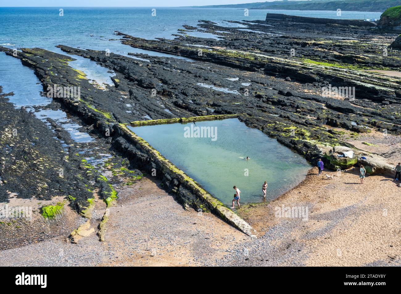 Swimmers in Castle Sands tidal pool below St Andrews Castle in the ...