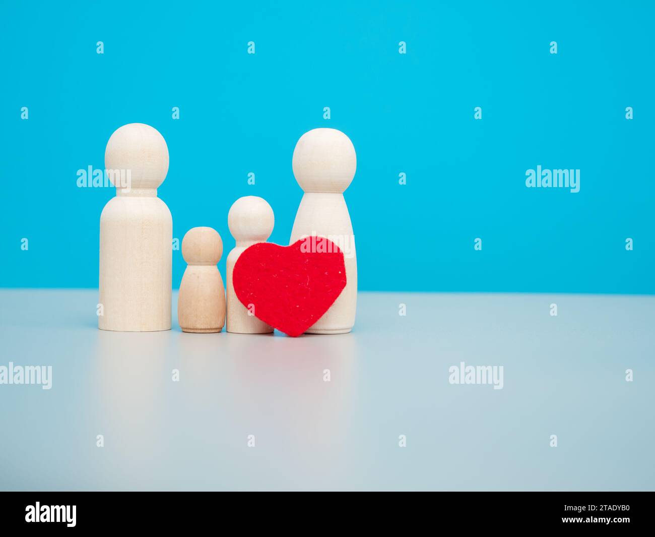 Wooden figures. Family on a gray background. Family values concept ...