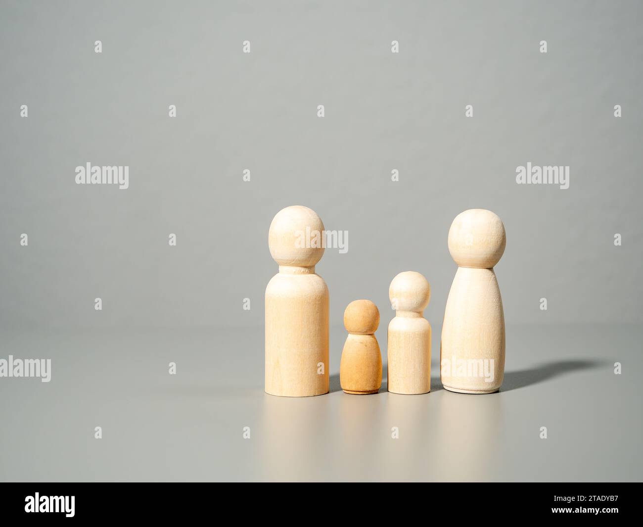 Wooden figures. Family on a gray background. Family values concept ...