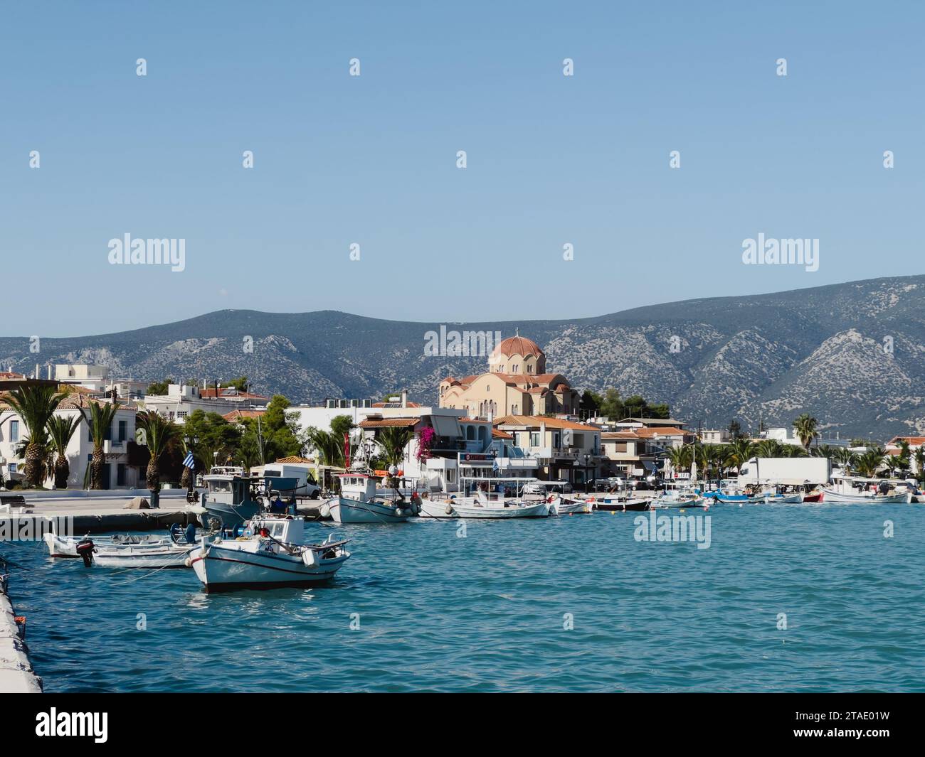 Afines, Greece - 20 august 2023: Boats are moored off the coast of the ...