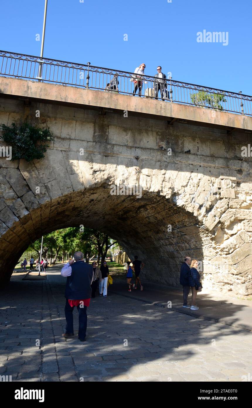 Pedestrian walking under arch hi-res stock photography and images - Alamy