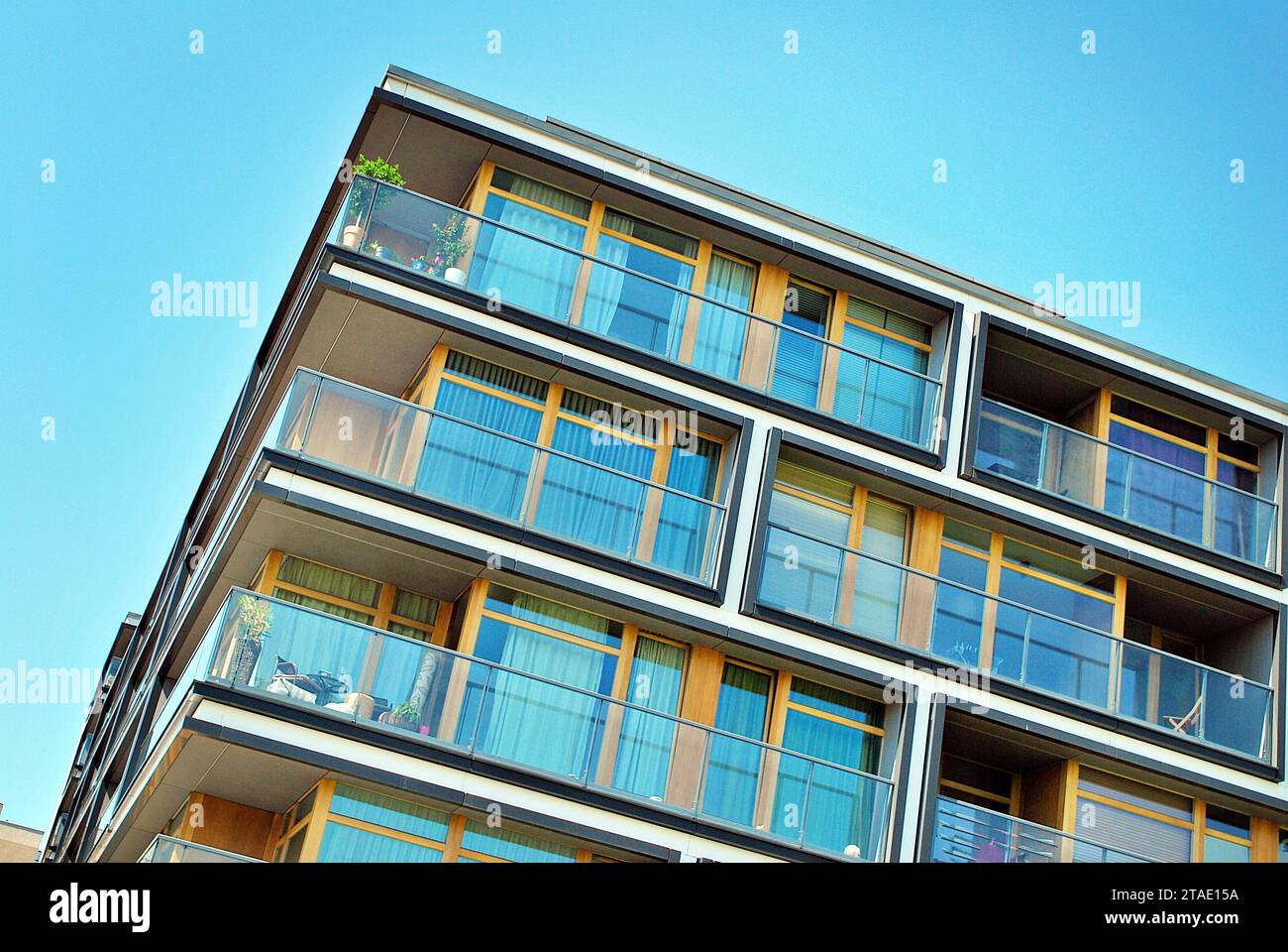 New apartment building with glass balconies. Modern architecture houses ...