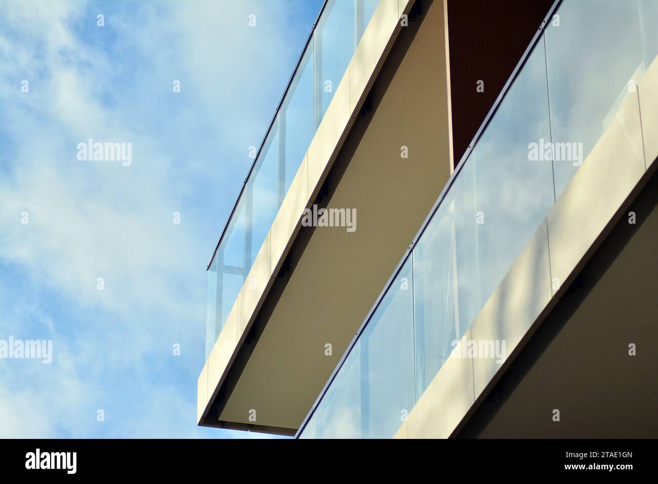 New apartment building with glass balconies. Modern architecture houses ...
