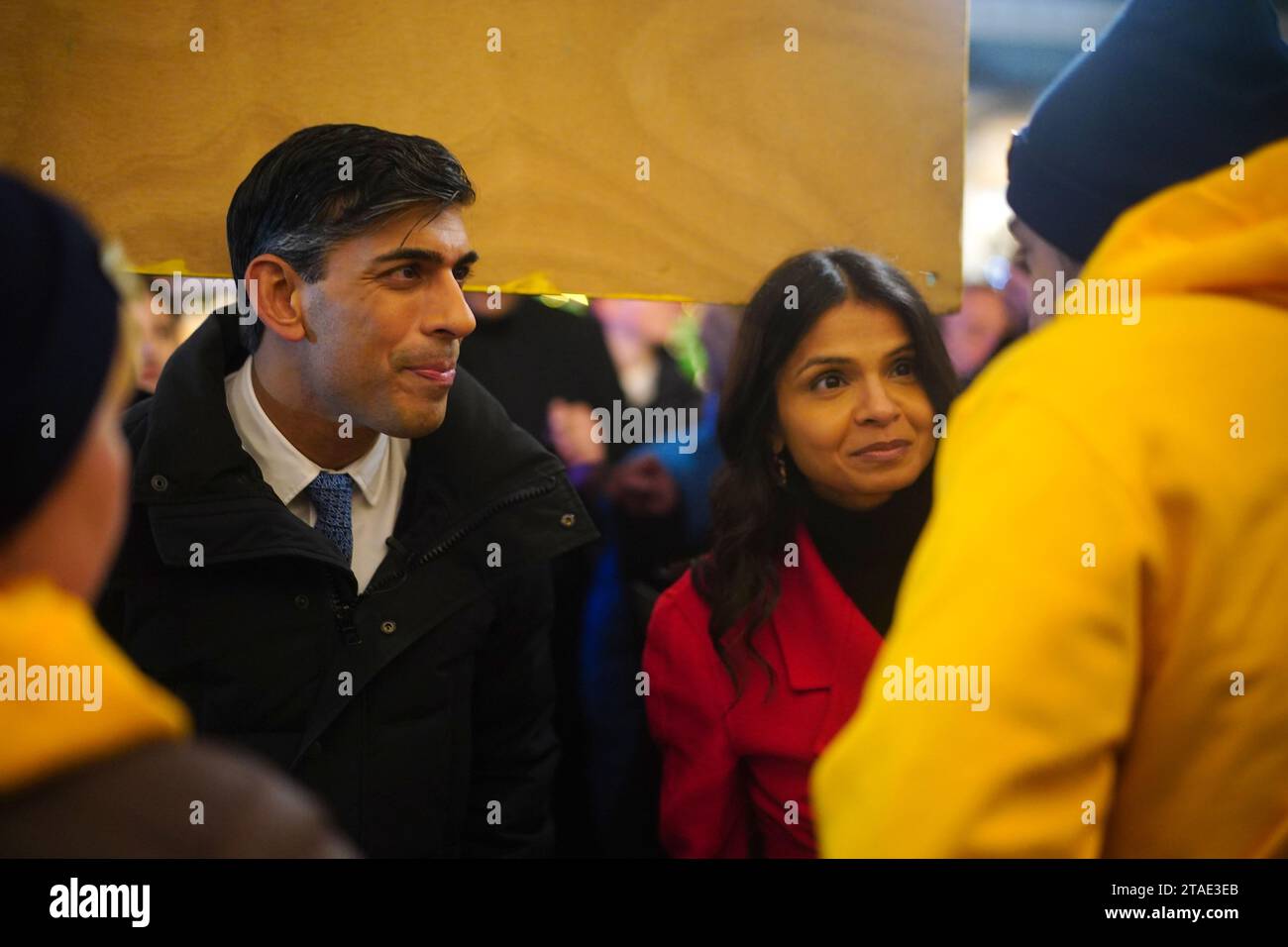 Prime Minister Rishi Sunak and his wife Akshata Murty, speak to stall ...