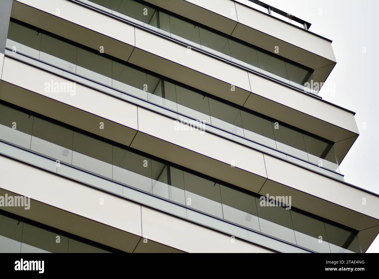 New apartment building with glass balconies. Modern architecture houses ...