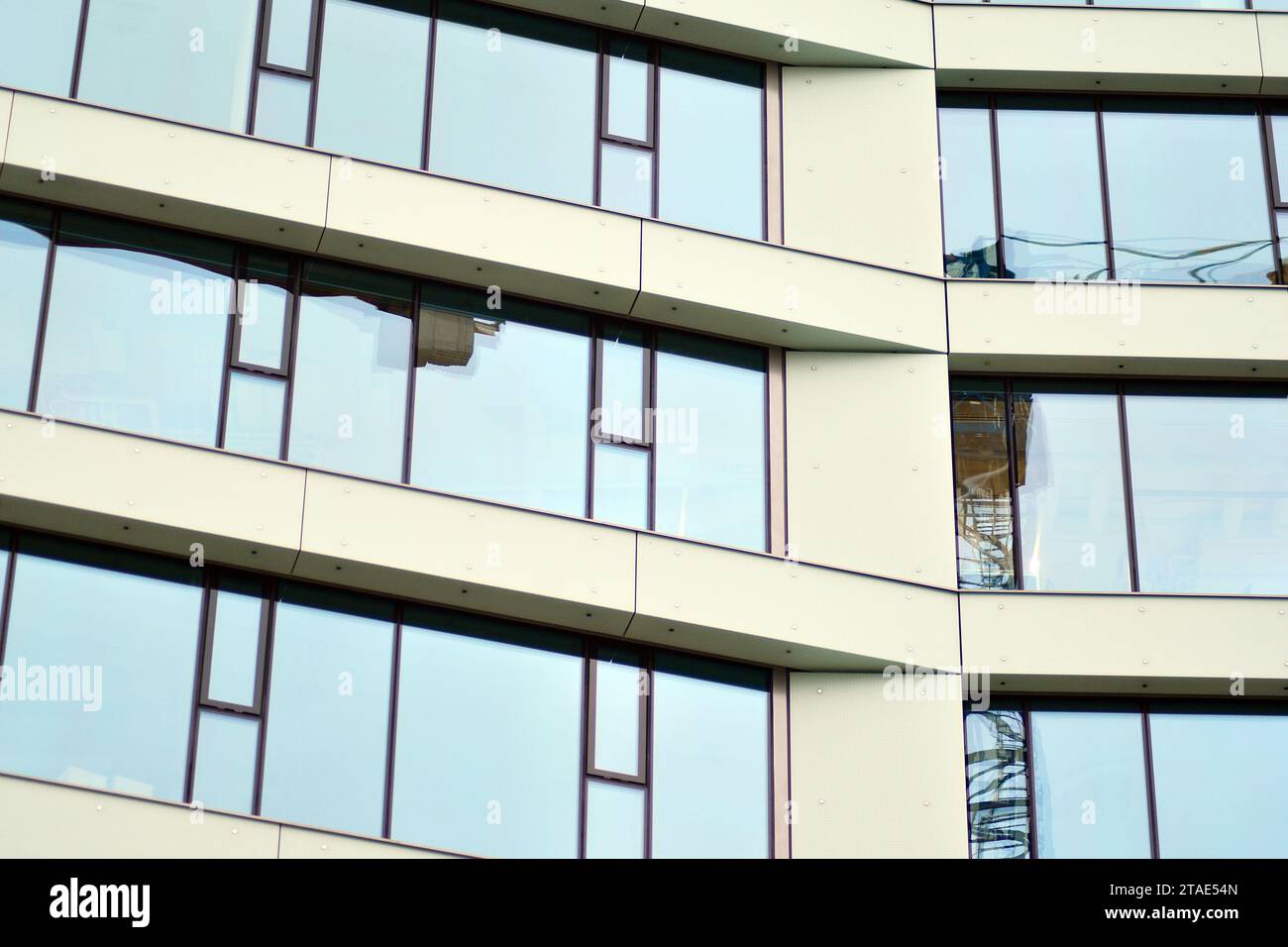 Modern office building with white metallic panel facade and windows ...
