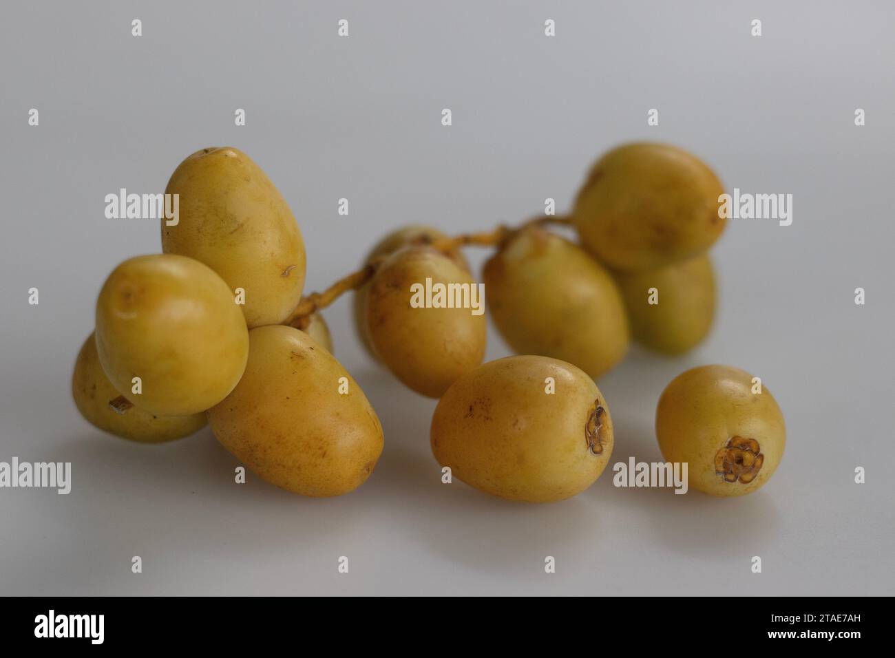 Yellow dates. Vibrant cluster of golden dates, ripe and ready to ...