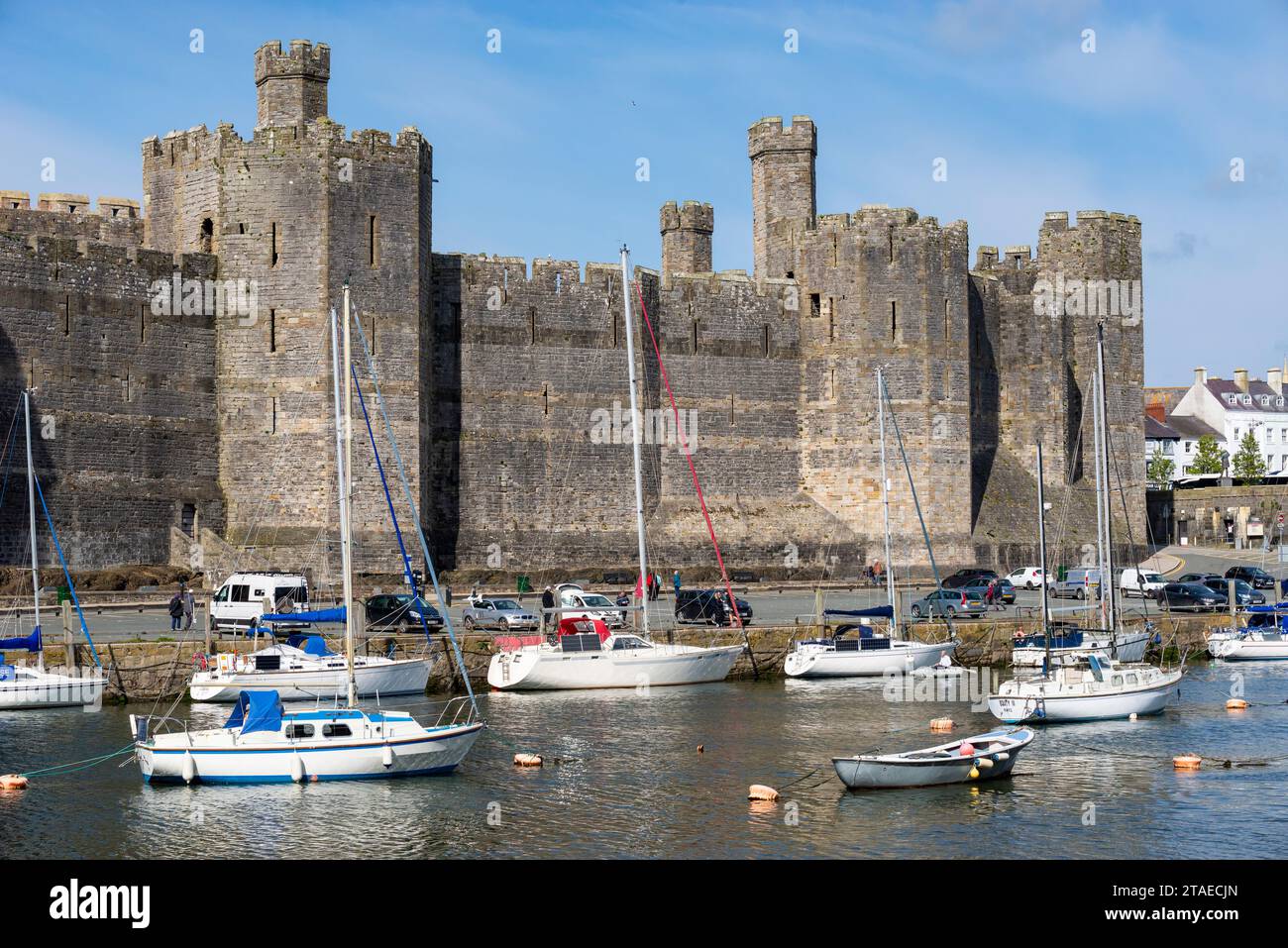 Caernarfon Castle and boats moored on the river Seiont, Gwynedd, North ...