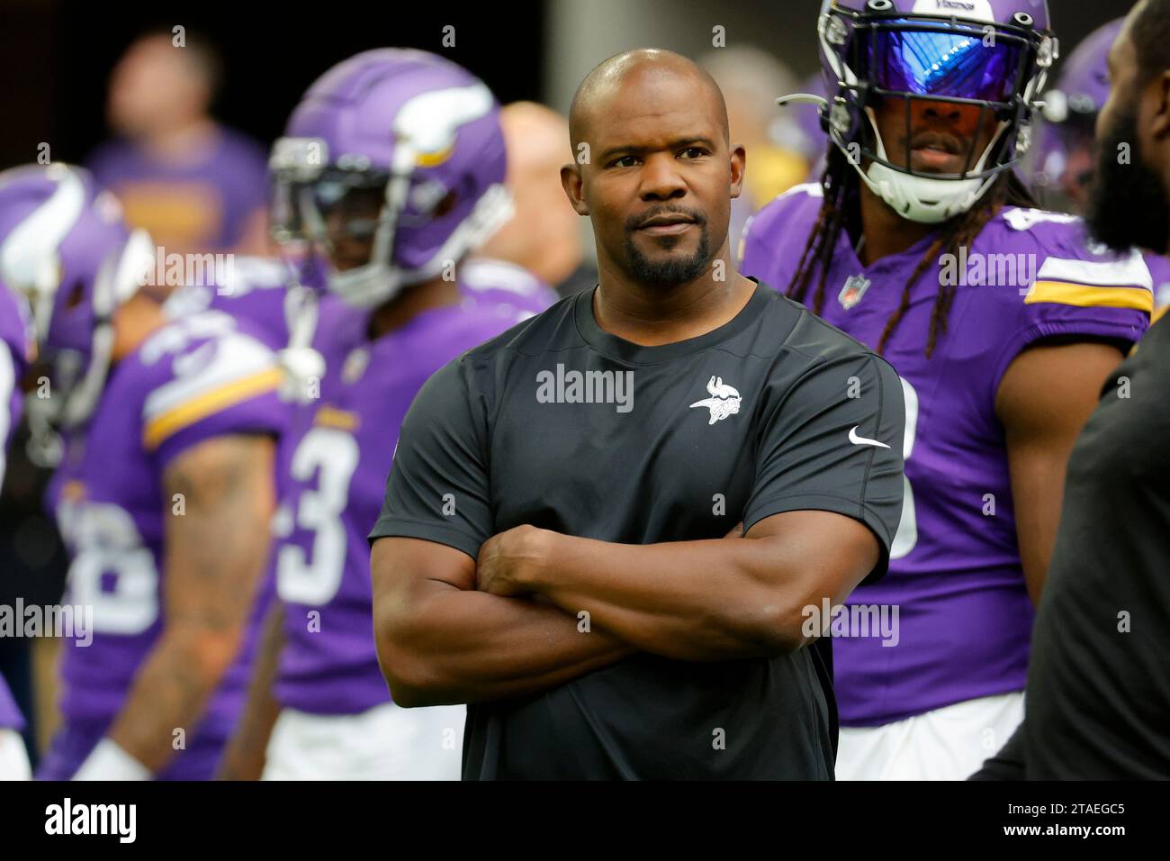 FILE - Minnesota Vikings defensive coordinator Brian Flores watches his players prior to an NFL ...