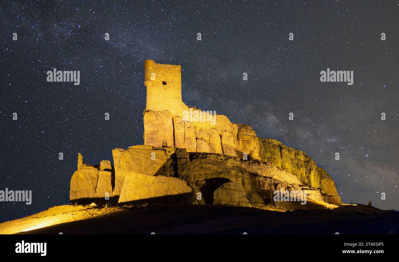 Atienza Castle illuminated in the darkness of the night with the Milky ...