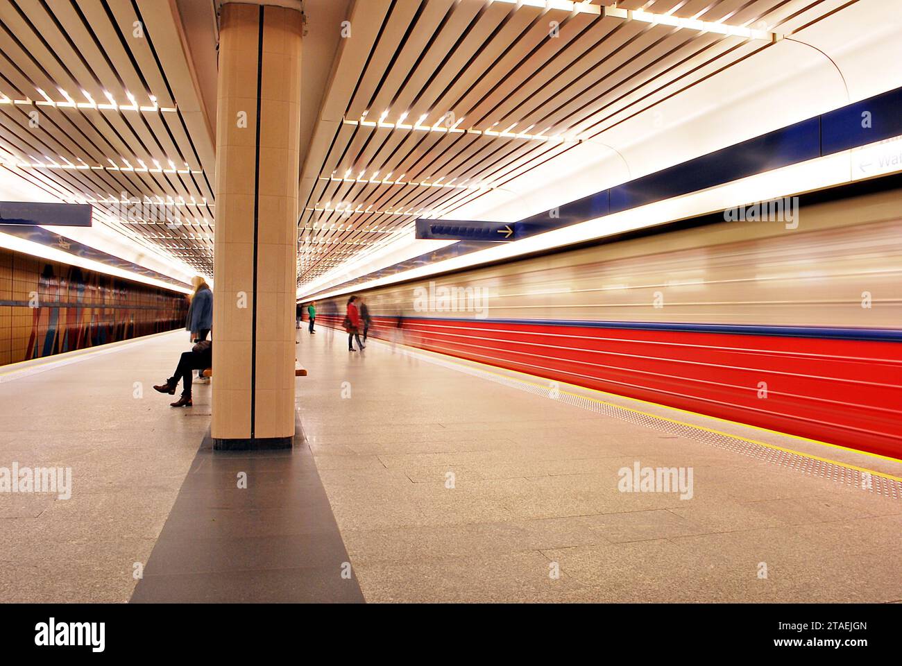 Fast motion of metro train. Long exposure of a passing-by passenger ...