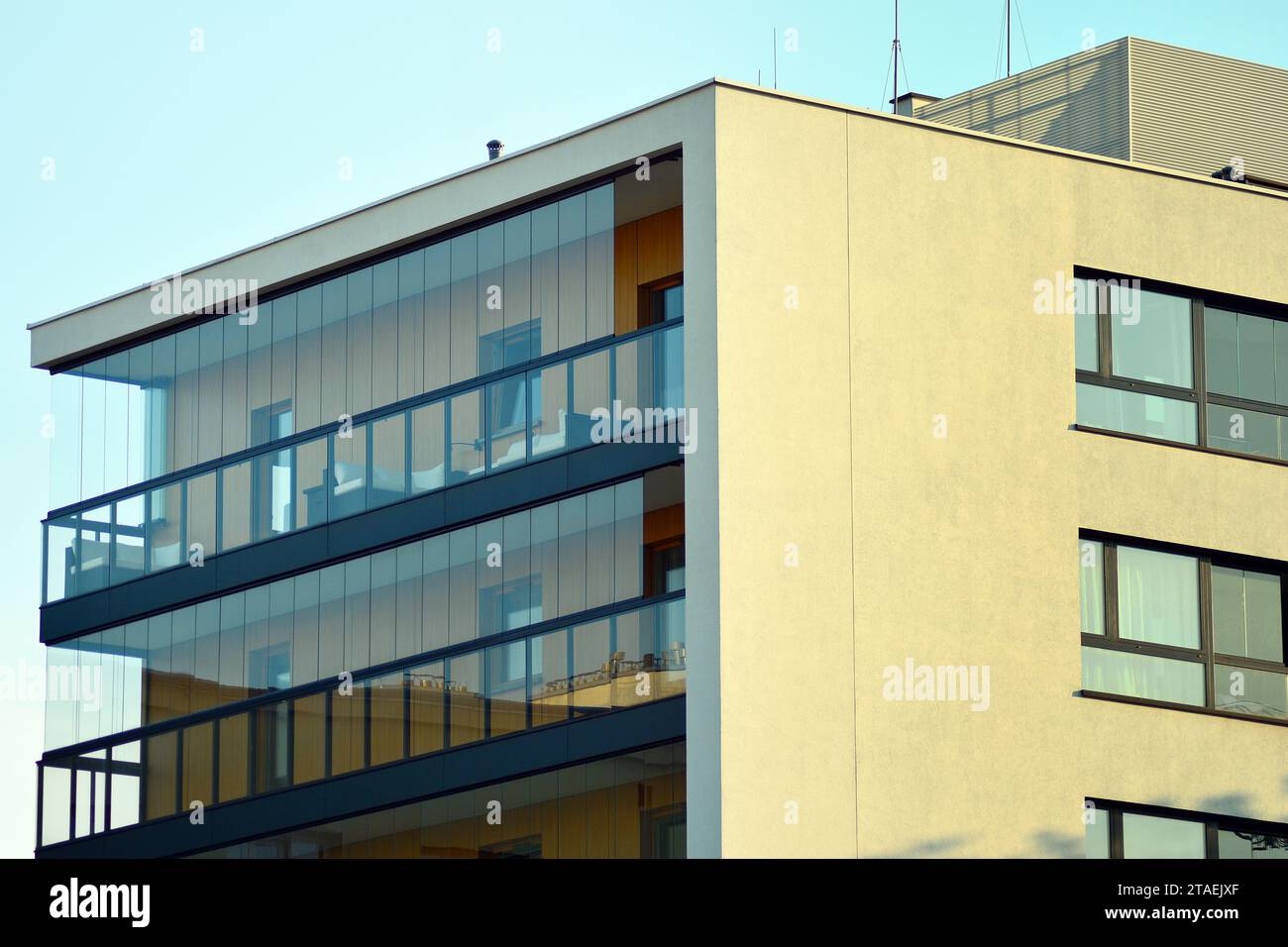 New apartment building with glass balconies. Modern architecture houses ...