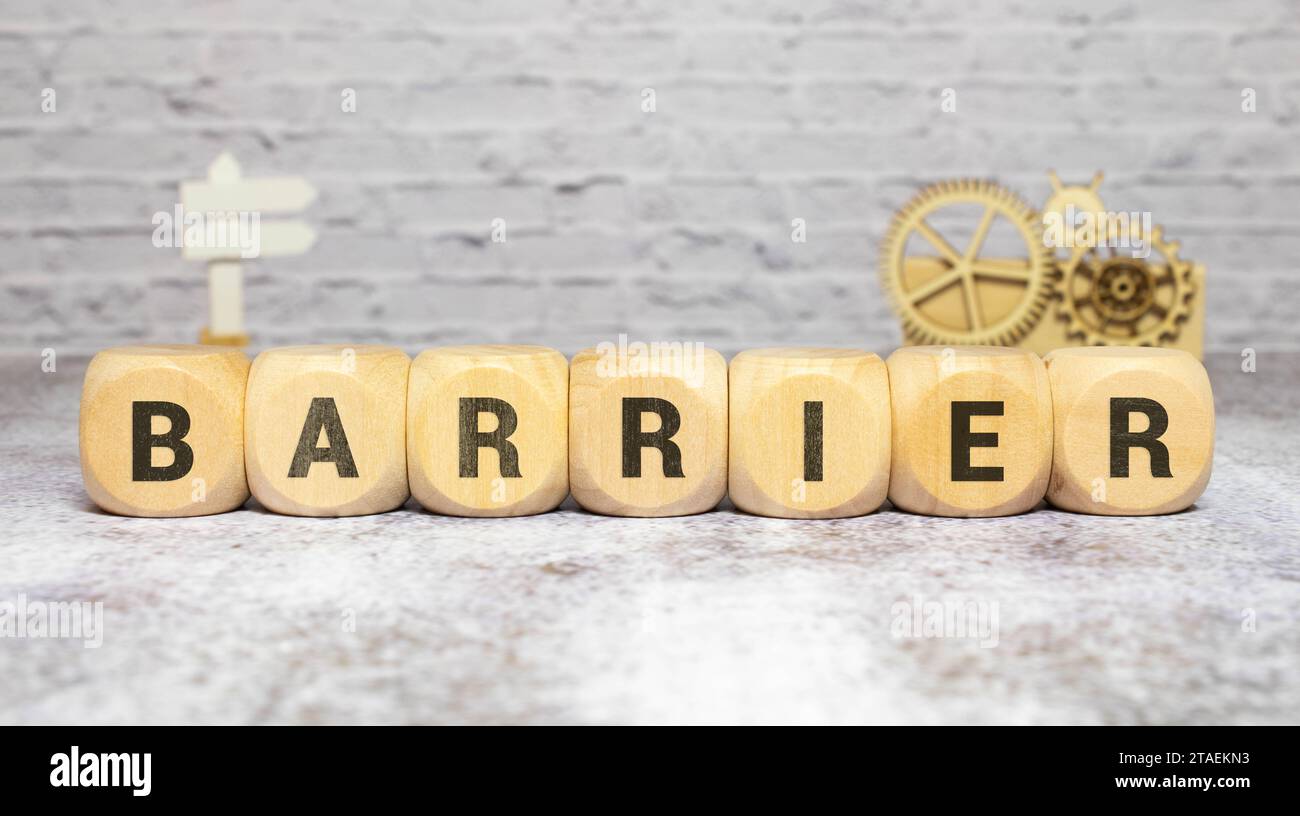 BARRIER word written on wood block Stock Photo - Alamy