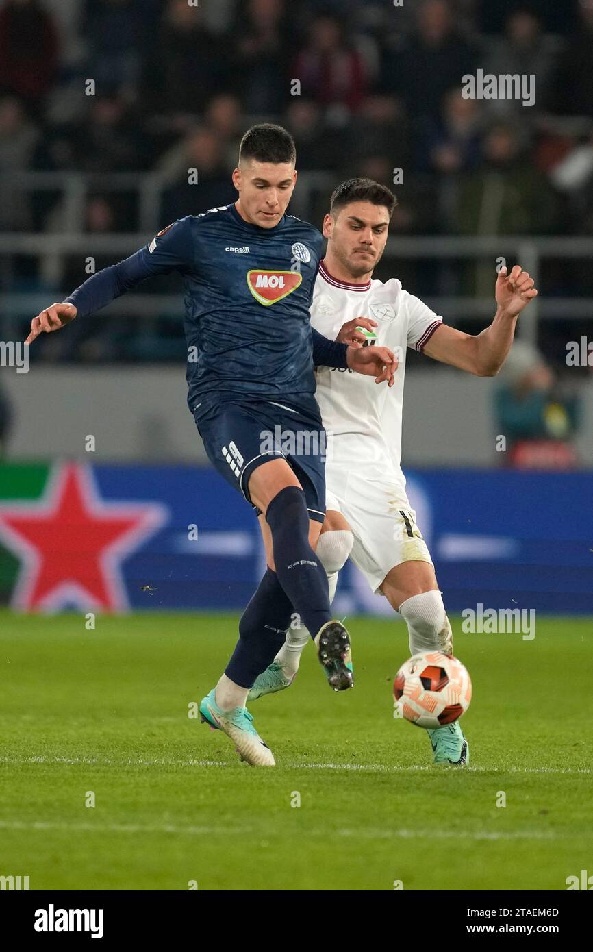 TSC's Uros Milovanovic, left, challenges for the ball with West Ham's ...