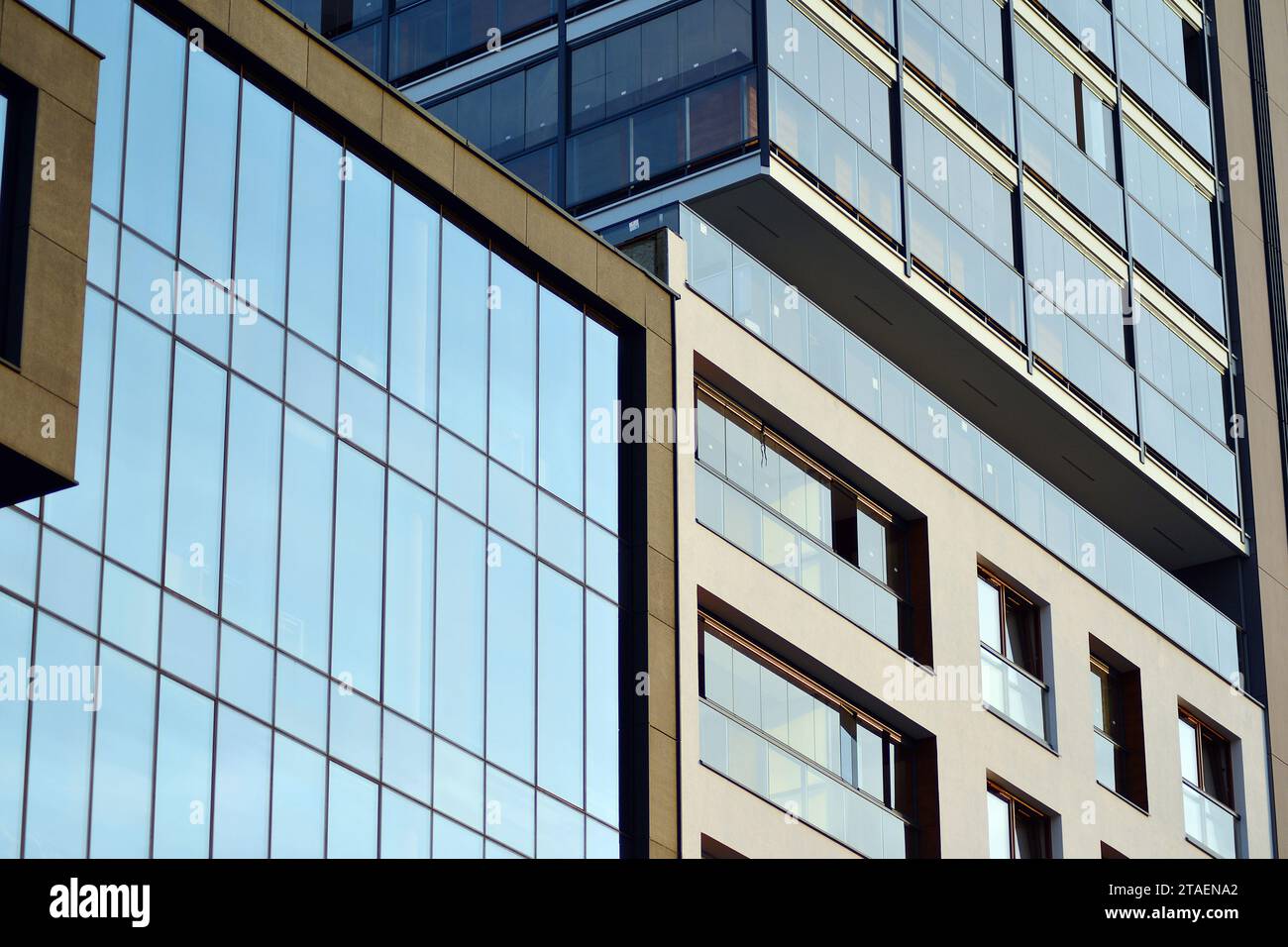 New apartment building with glass balconies. Modern architecture houses ...