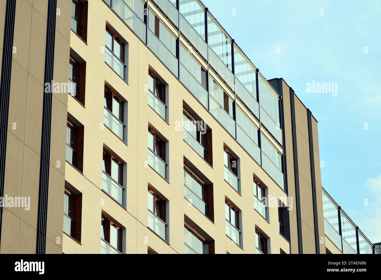 New apartment building with glass balconies. Modern architecture houses ...