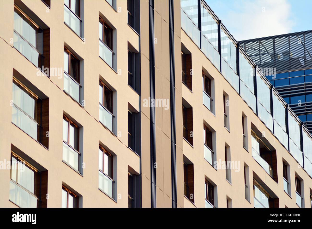 New apartment building with glass balconies. Modern architecture houses ...