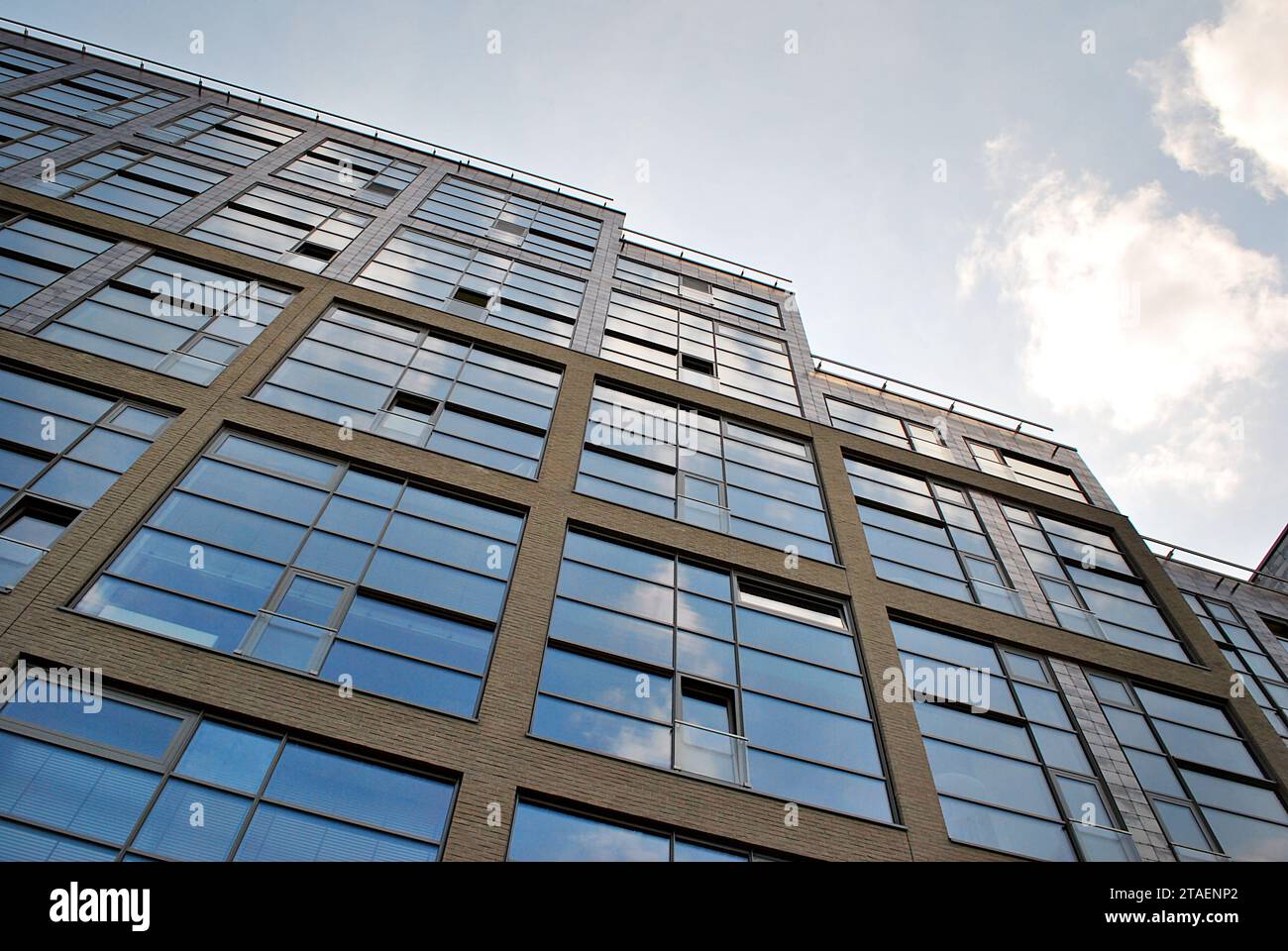 New apartment building with glass balconies. Modern architecture houses ...