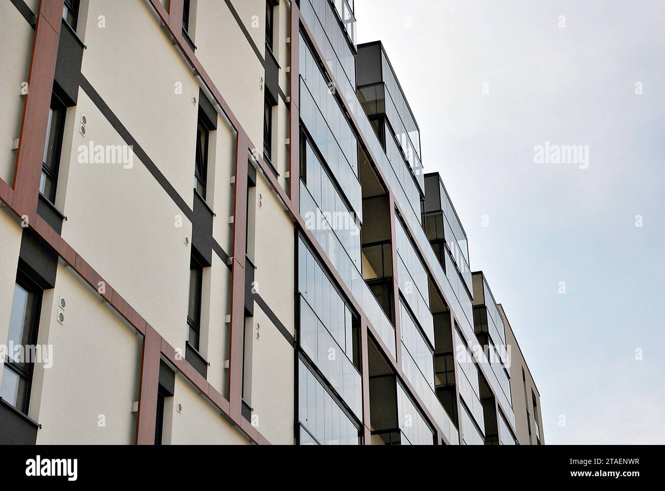 New apartment building with glass balconies. Modern architecture houses ...