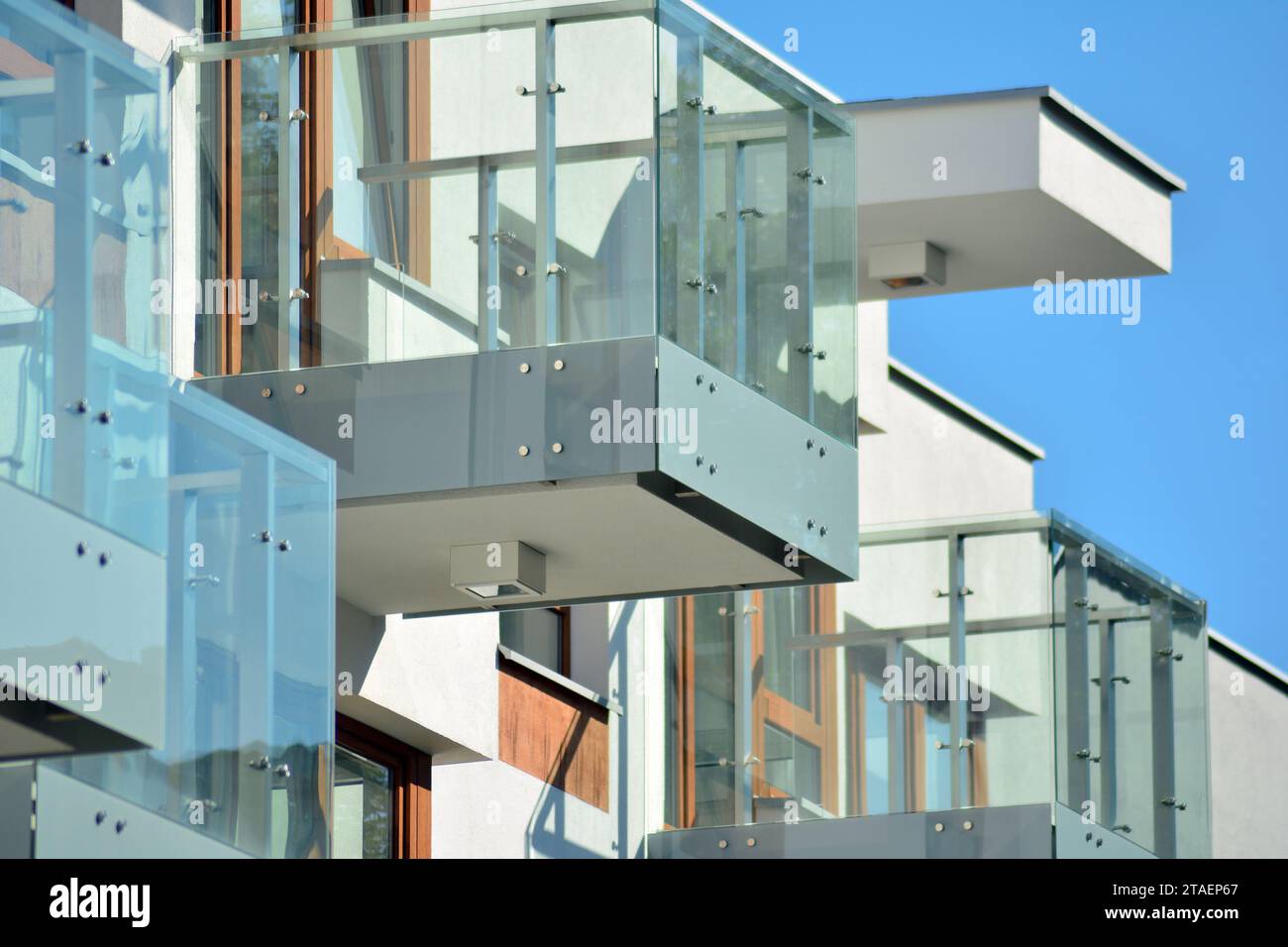 New apartment building with glass balconies. Modern architecture houses ...