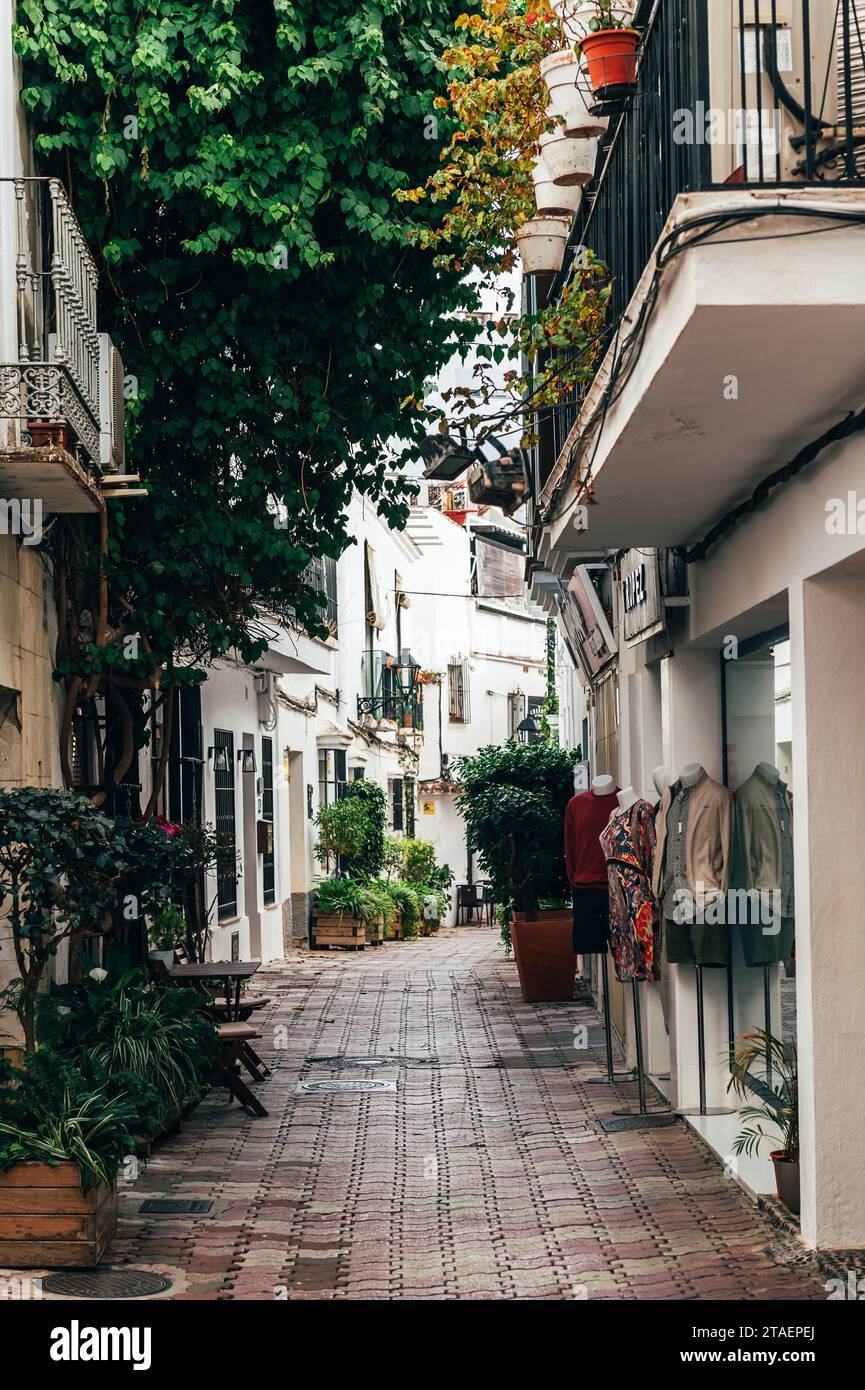 Cafe tables on Streets of Marbella, Spain Stock Photo - Alamy