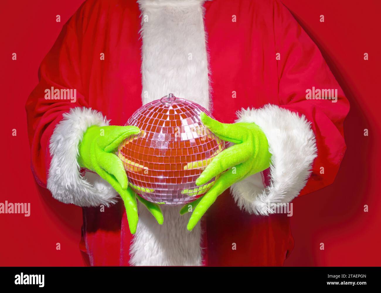 Christmas Grinch Holding a Disco Ball for the Holidays Stock Photo - Alamy