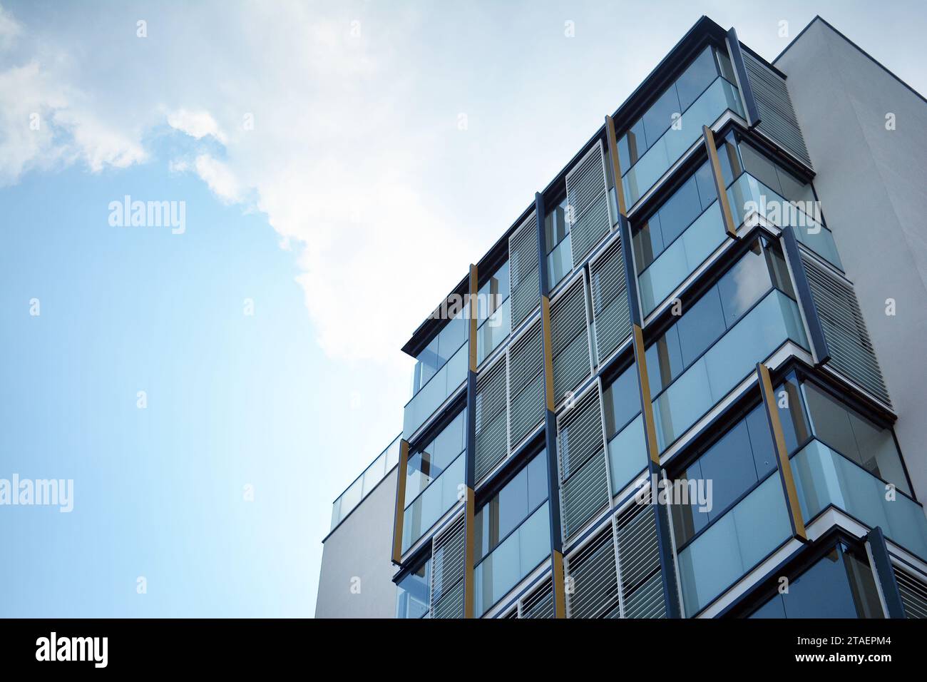 New apartment building with glass balconies. Modern architecture houses ...