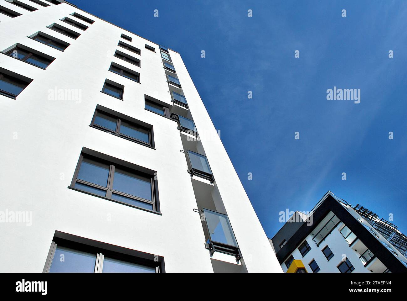 New apartment building with glass balconies. Modern architecture houses ...