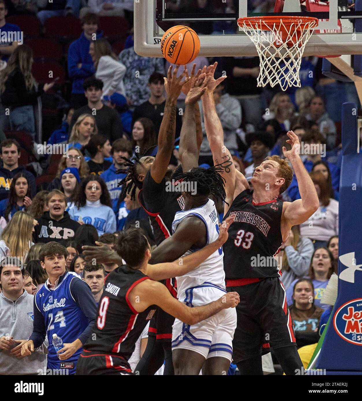 Northeastern Huskies forward Chris Doherty (33) and guard JB Frankel ...