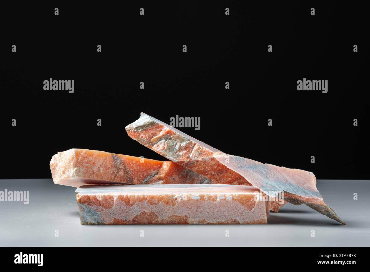 Piece of granite stone against black background Stock Photo - Alamy