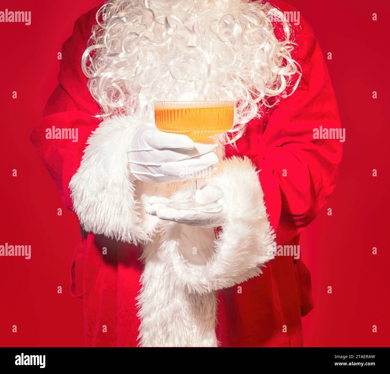 Christmas Santa Holding a Bubbly Champagne Cocktail in a Beautiful ...
