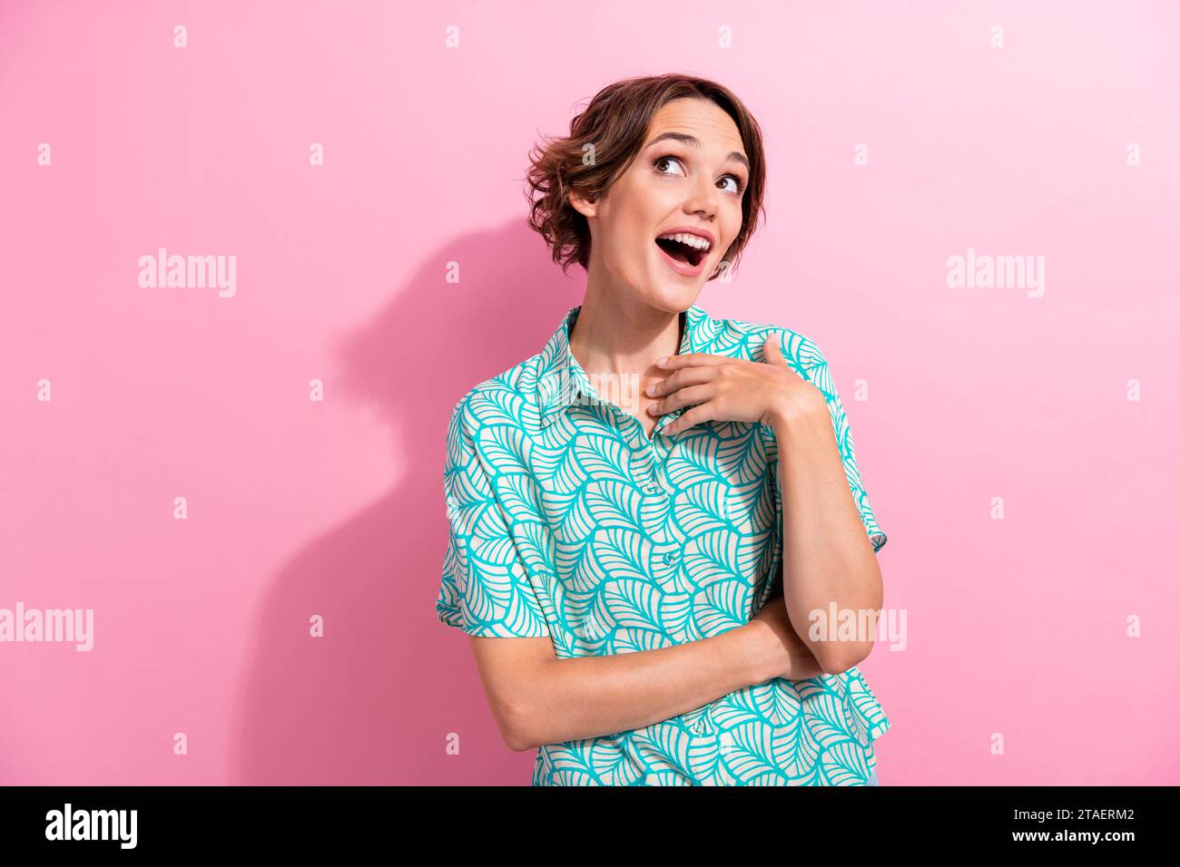 Photo of lovely astonished lady open mouth look interested empty space ...