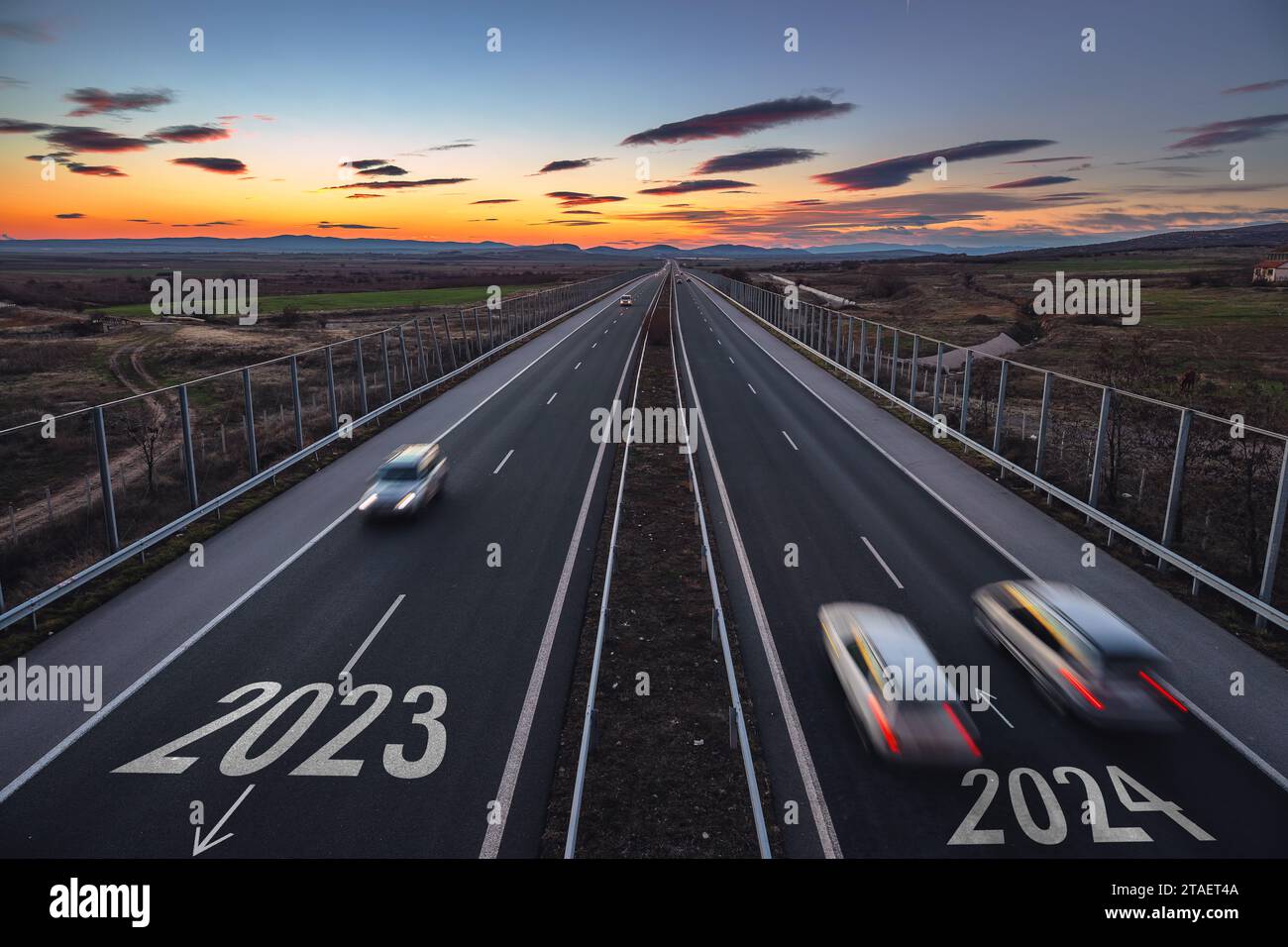 Driving on open road at beautiful sunny day to new year 2024. Aerial ...