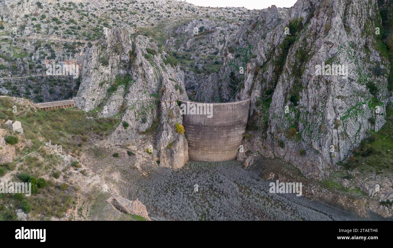 Stone dam of Montejaque, Spain in a rugged mountain landscape with ...