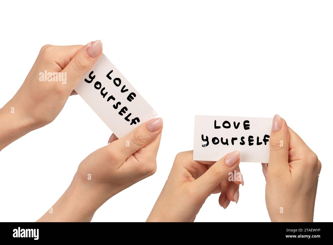 Love yourself text on a card in a woman hand isolated on a white ...