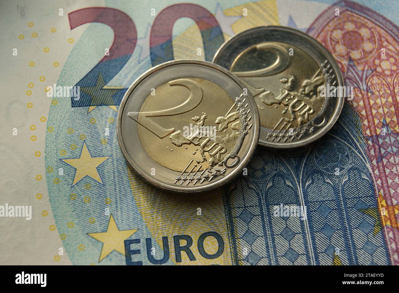 Two Euro coins on a banknote. Proof bimetallic European coins Stock ...