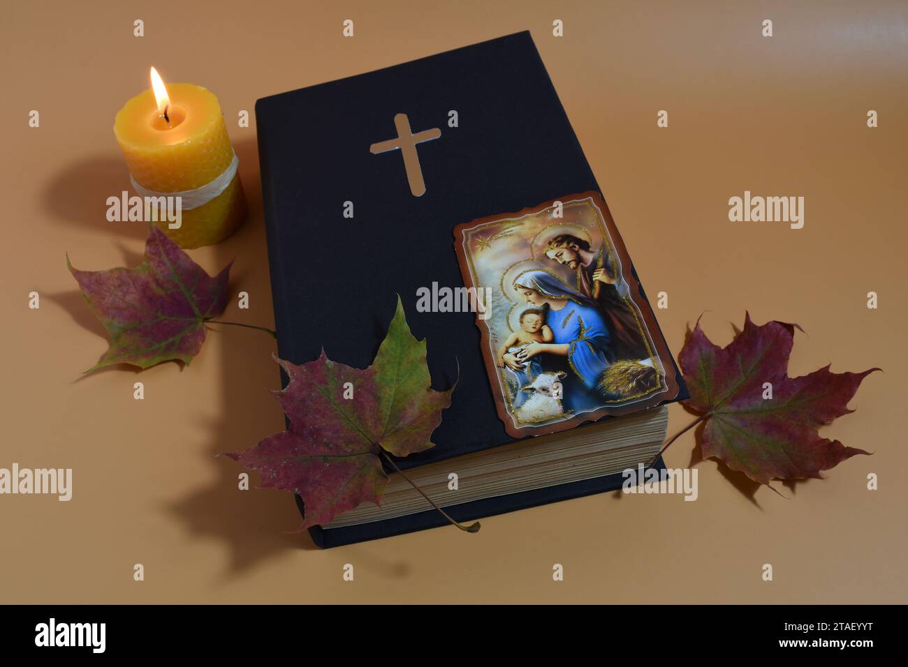 Holy bible, advent candle. Advent concept. Maple leaves Stock Photo - Alamy