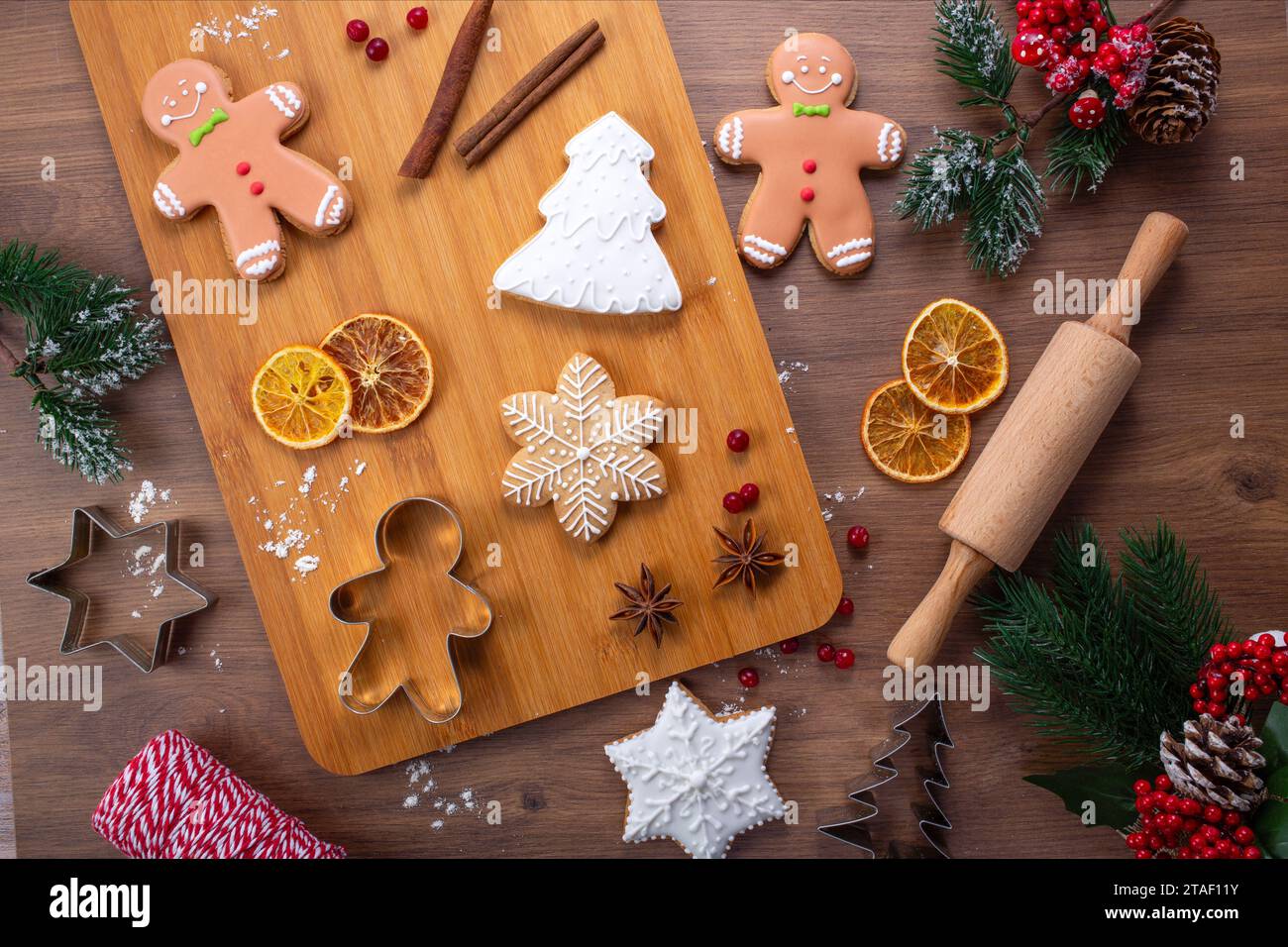 Christmas bake tools on flour and rustic wooden background, flat lay ...