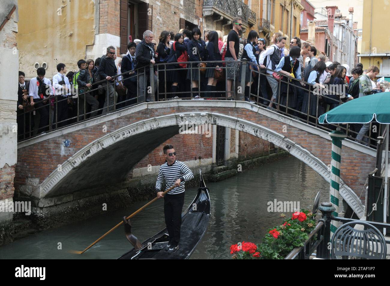 VENICE, ITALY - MAY 18, 2012: Tourists in the crowded the bridge in ...