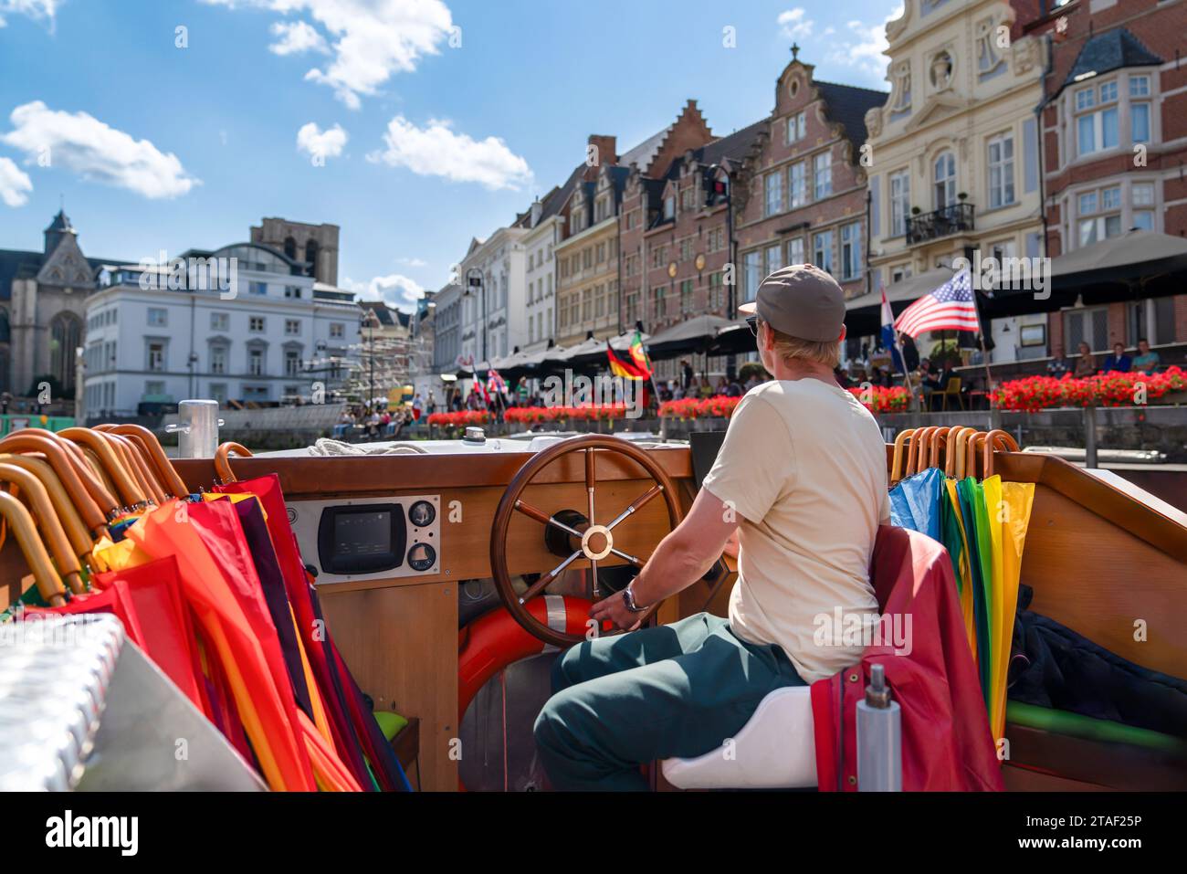 The boat captain (guide) is on duty to guide tourists on a boat trip ...