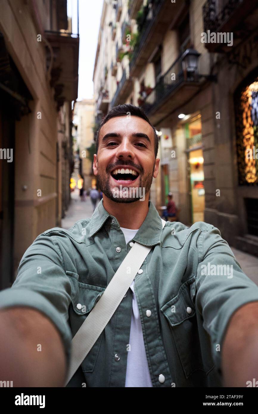 Happy selfie of a young caucasian man in an old town of Barcelona Stock ...