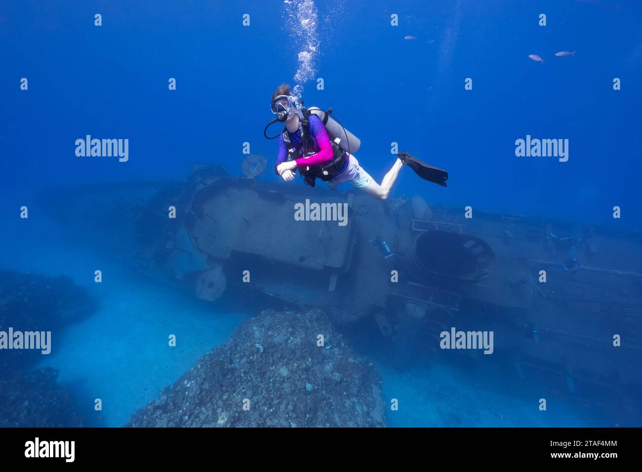 A scuba diver heads for his safety stop after a dive on the USS ...