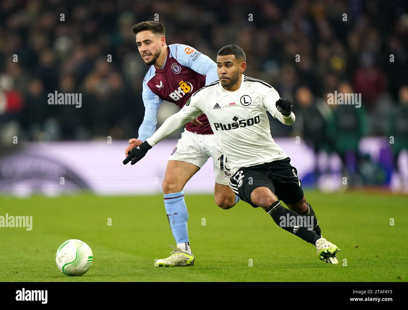 Aston Villa's Alex Moreno (left) and Legia Warsaw's Juergen Elitim ...