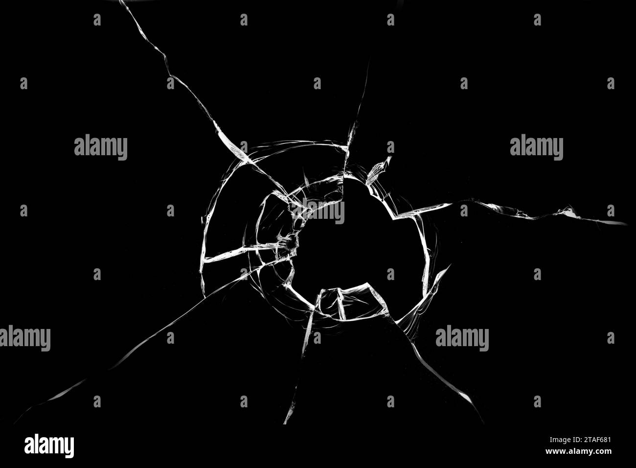 Broken glass from a bullet. Texture of broken glass Stock Photo - Alamy