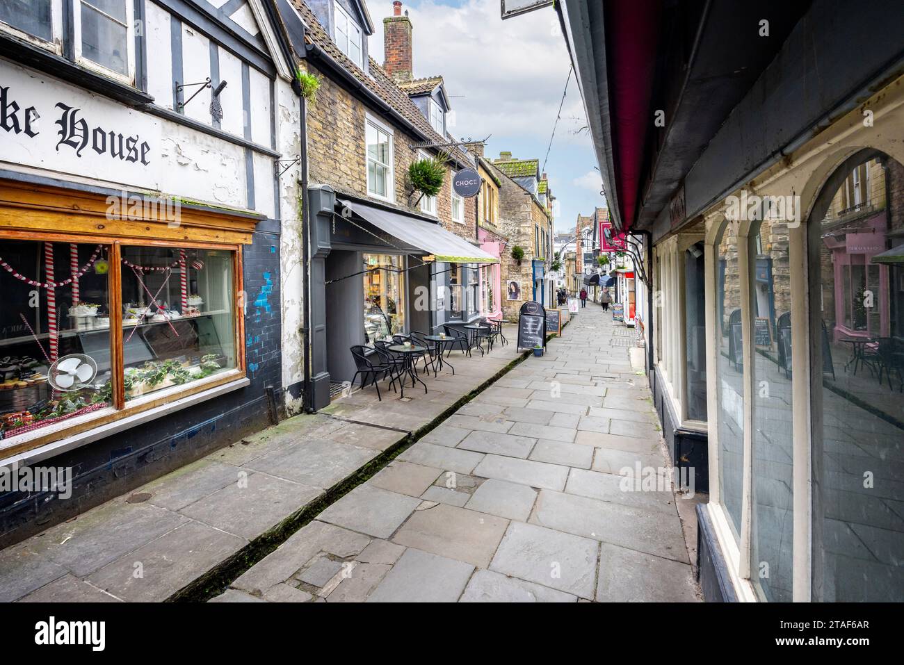 Shops and cafes in historic Cheap Street in Frome, Somerset, UK on 30 ...