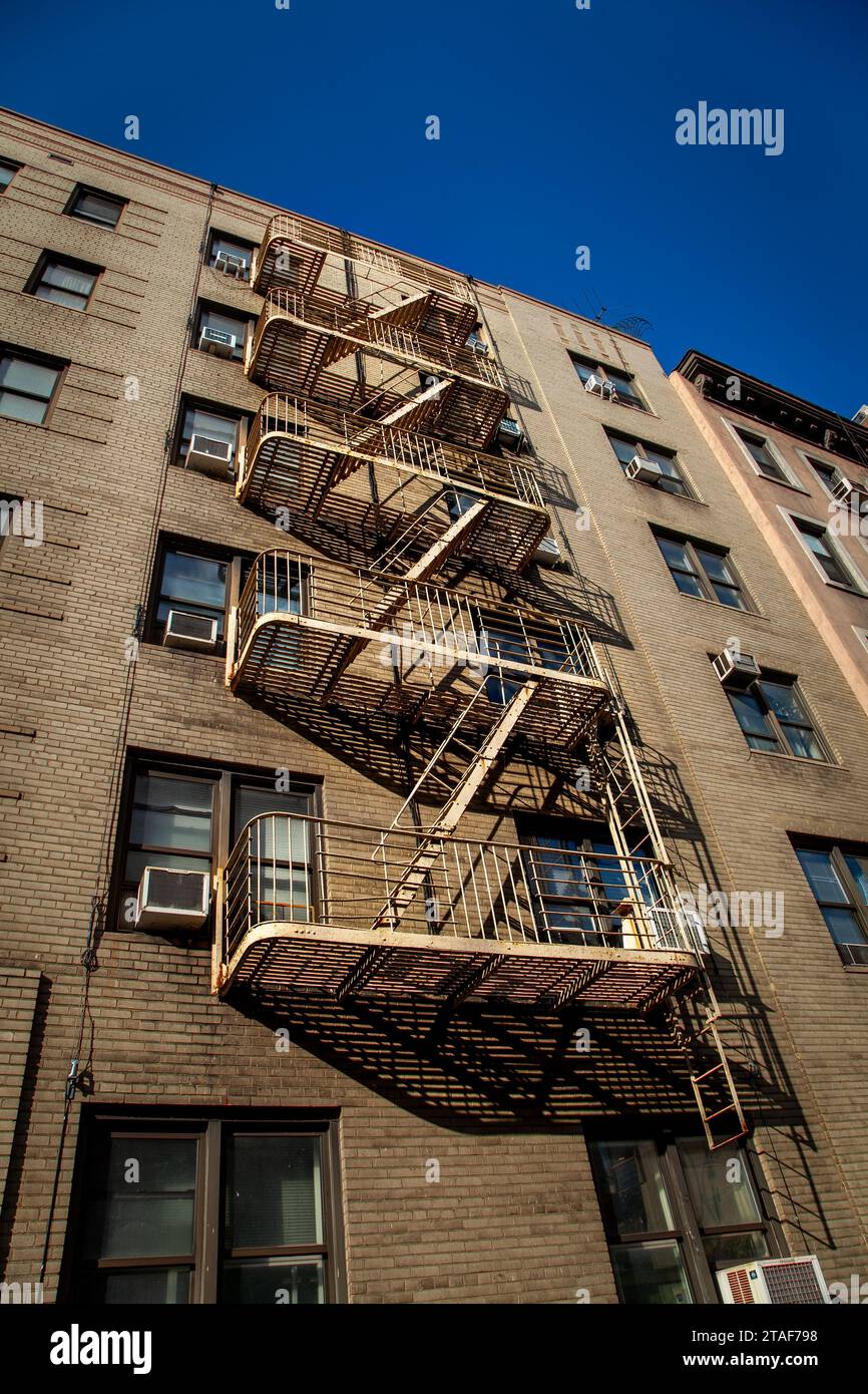 Fire escape ladders on apartment builds Stock Photo - Alamy