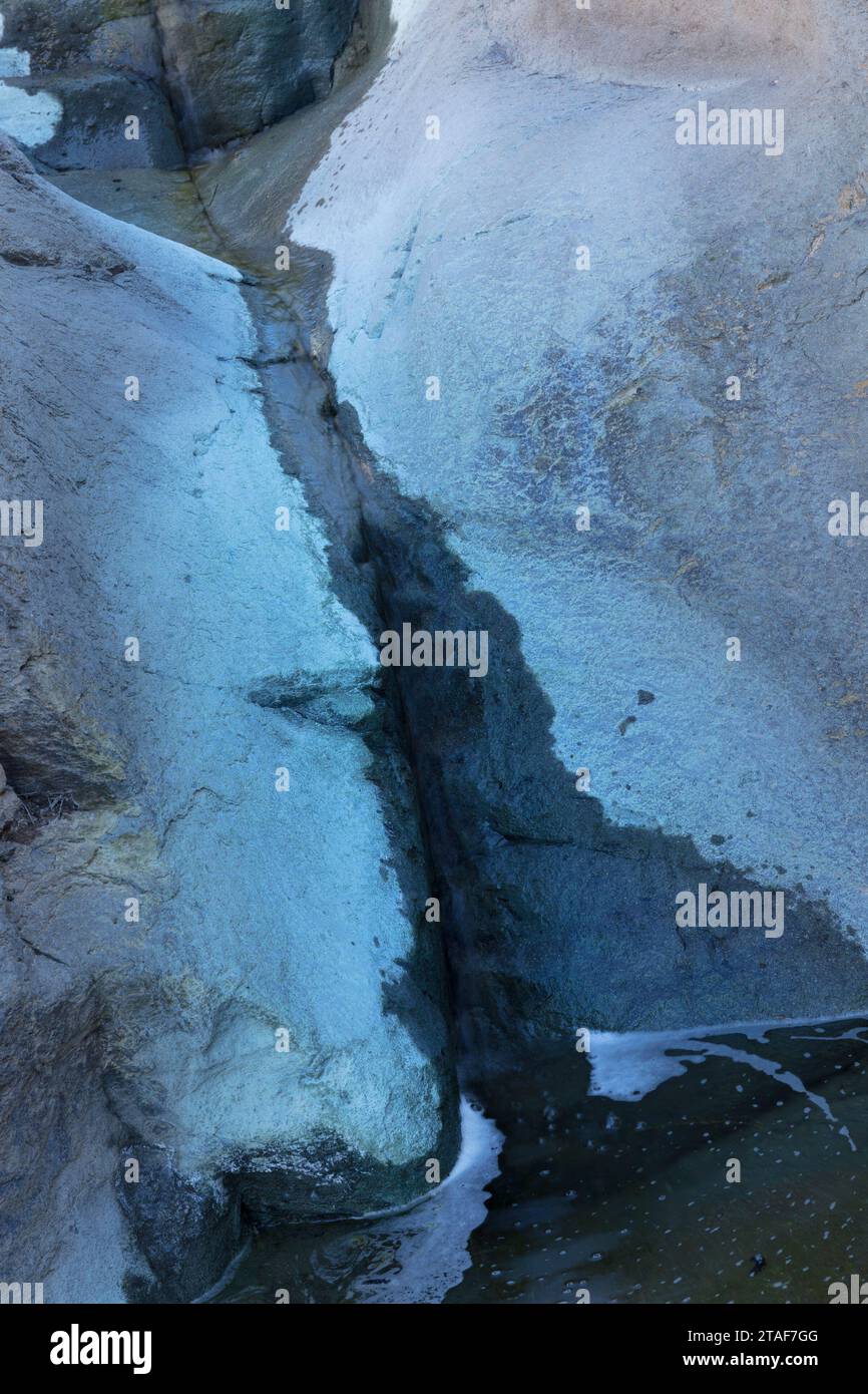 Copper deposits coat the rock surface of a small waterfall Stock Photo ...