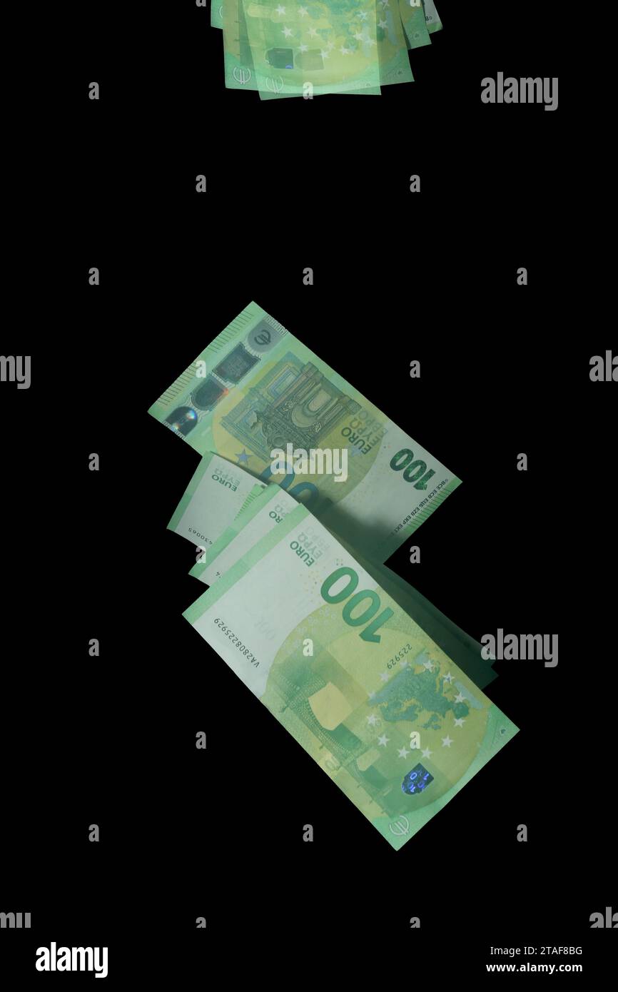 Stroboscopic photo of falling euro banknotes on dark background Stock ...