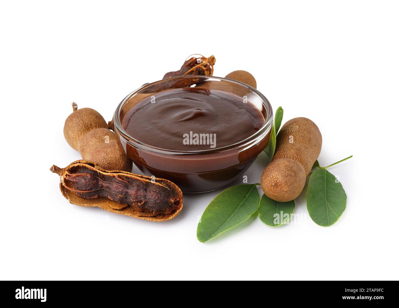 Bowl with tasty tamarind jam and fruits on white background Stock Photo ...