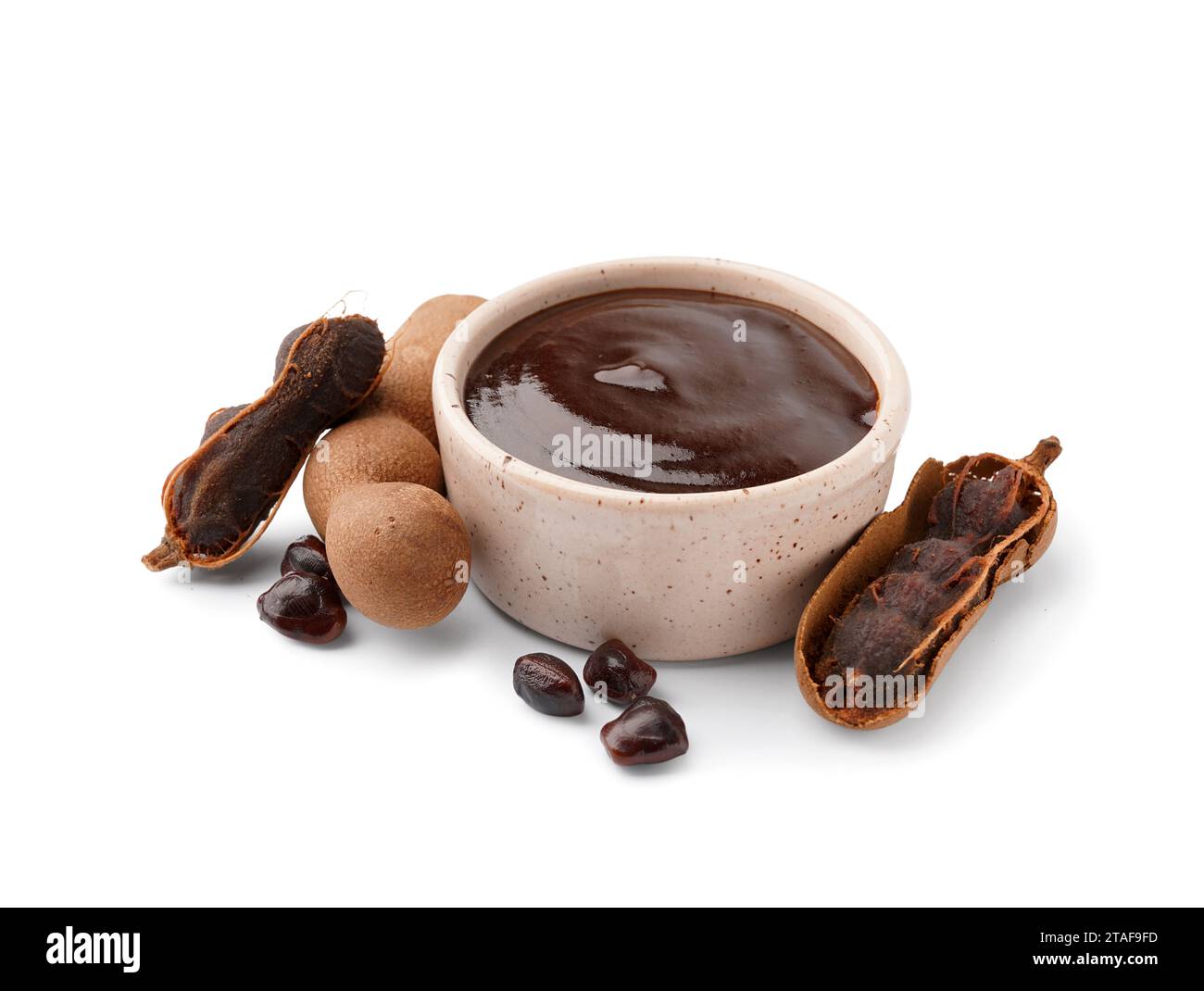 Bowl with tasty tamarind jam and fruits on white background Stock Photo ...